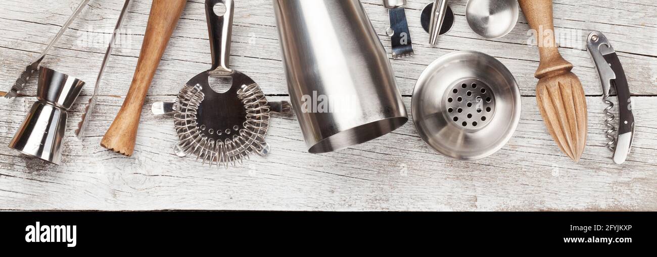 Cocktail utensils. Set of bar tools on wooden table. Top view flat lay ...