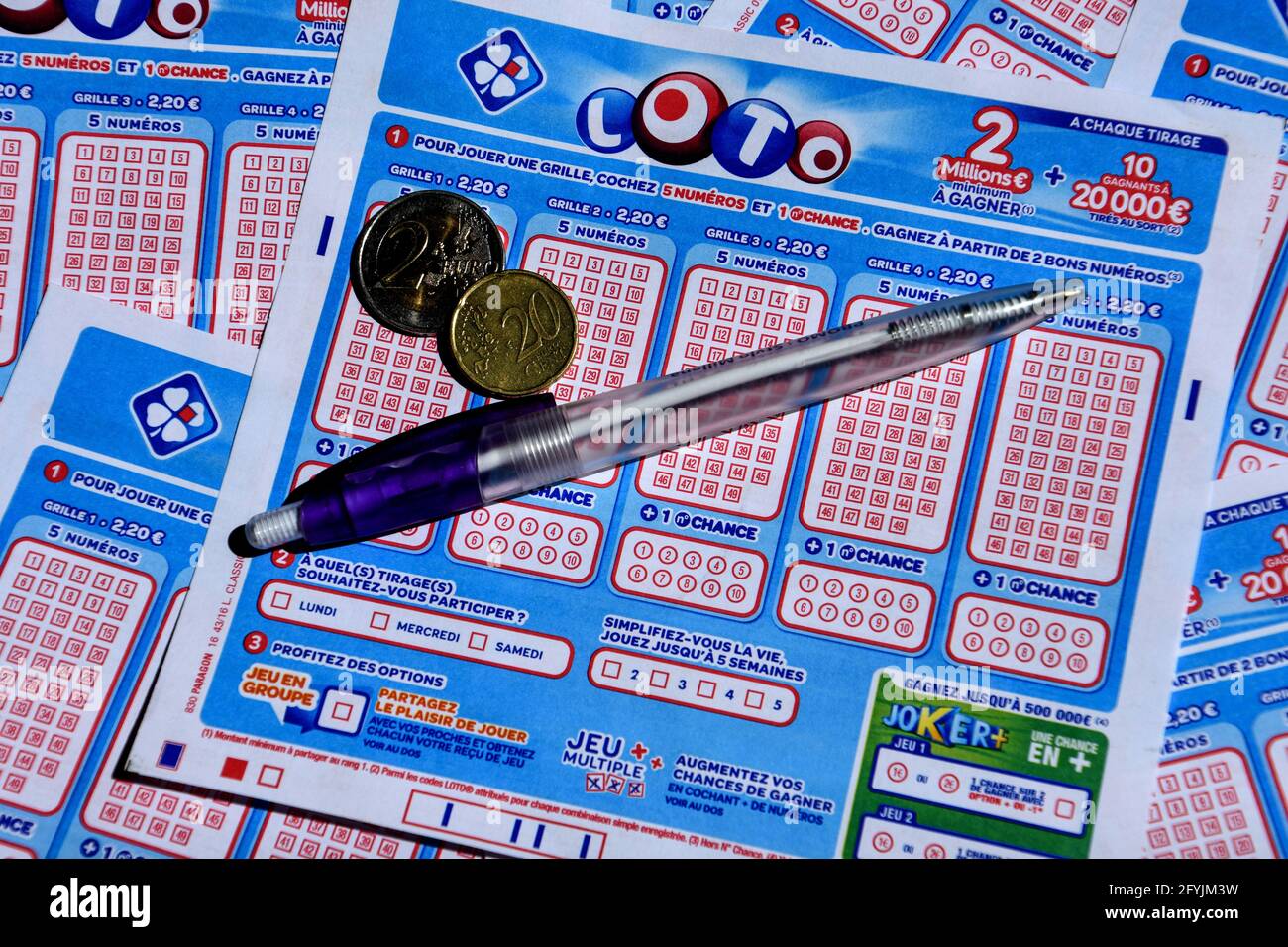 France. 23rd May, 2021. In this photo illustration, coins and a pen ...