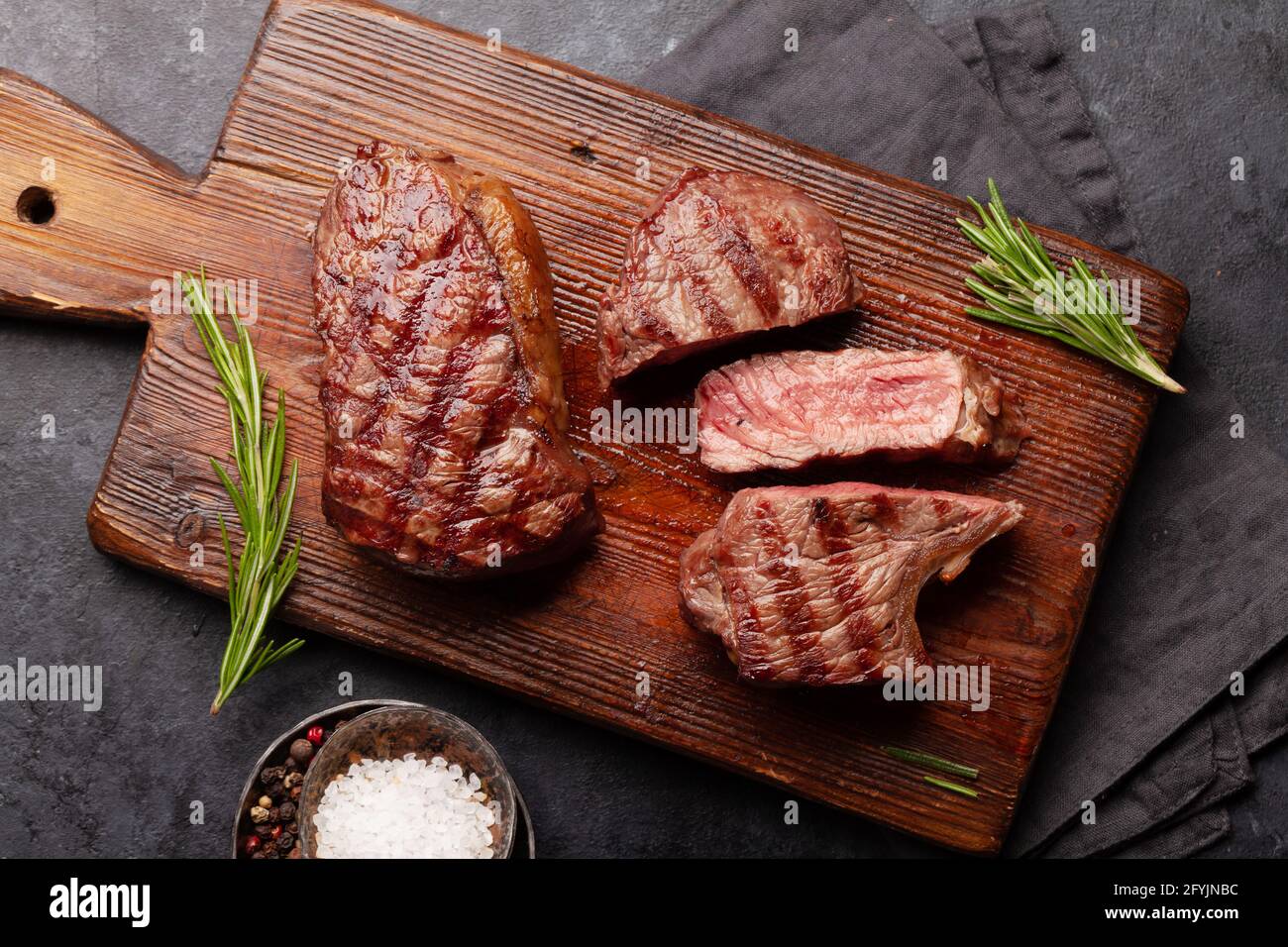 Grilled beef steak with spices and herbs. Top view flat lay Stock Photo ...