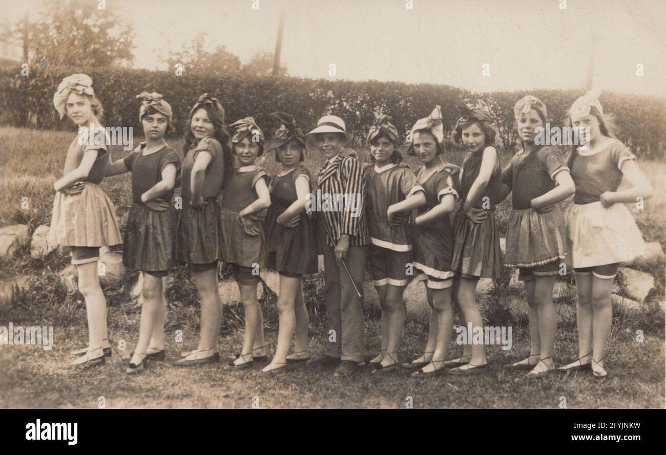 Group of girls dressed up and standing in line Stock Photo - Alamy