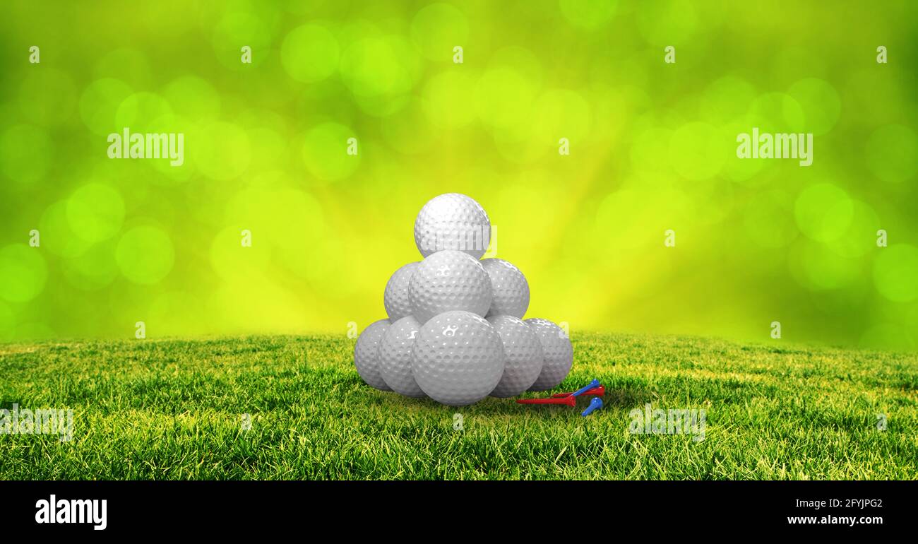 Composition of stack of golf balls in grass with tees and copy space ...
