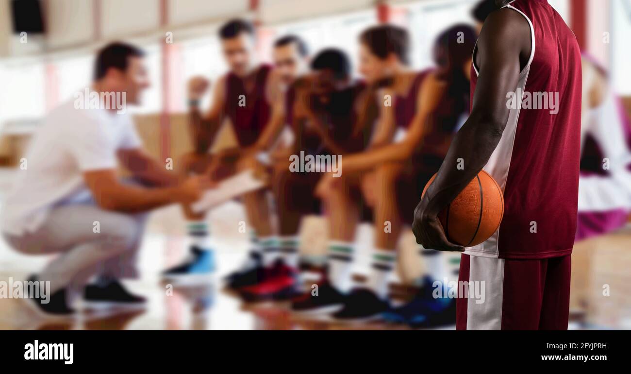 Composition of midsection of male basketball player with ball over ...