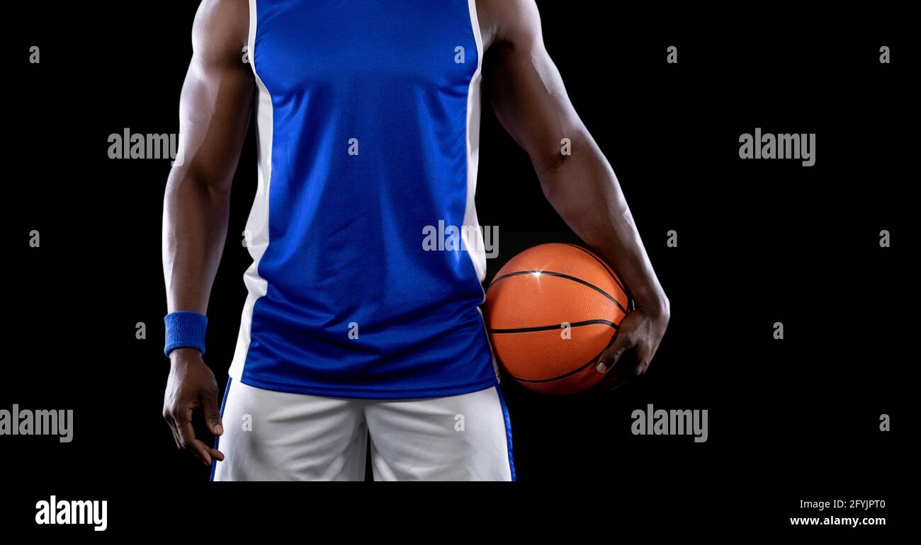 Composition of midsection of male basketball player with ball and copy ...
