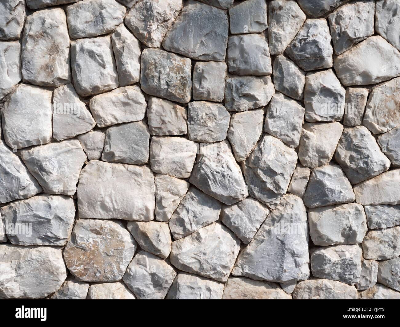 Alignment of white rock wall background Stock Photo - Alamy