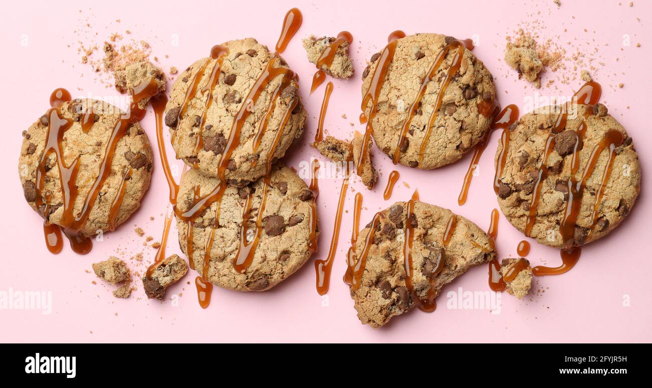 Cookies with caramel on pink background, space for text Stock Photo - Alamy