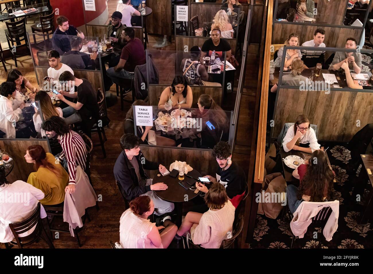 Transparent partitions used to preserve social distance seen inside a ...