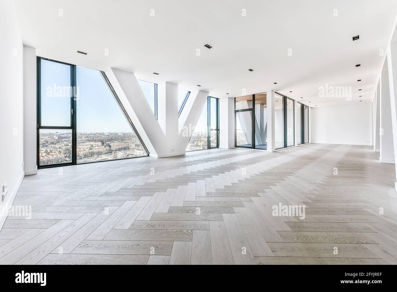 Spacious studio apartment with parquet flooring and panoramic windows ...