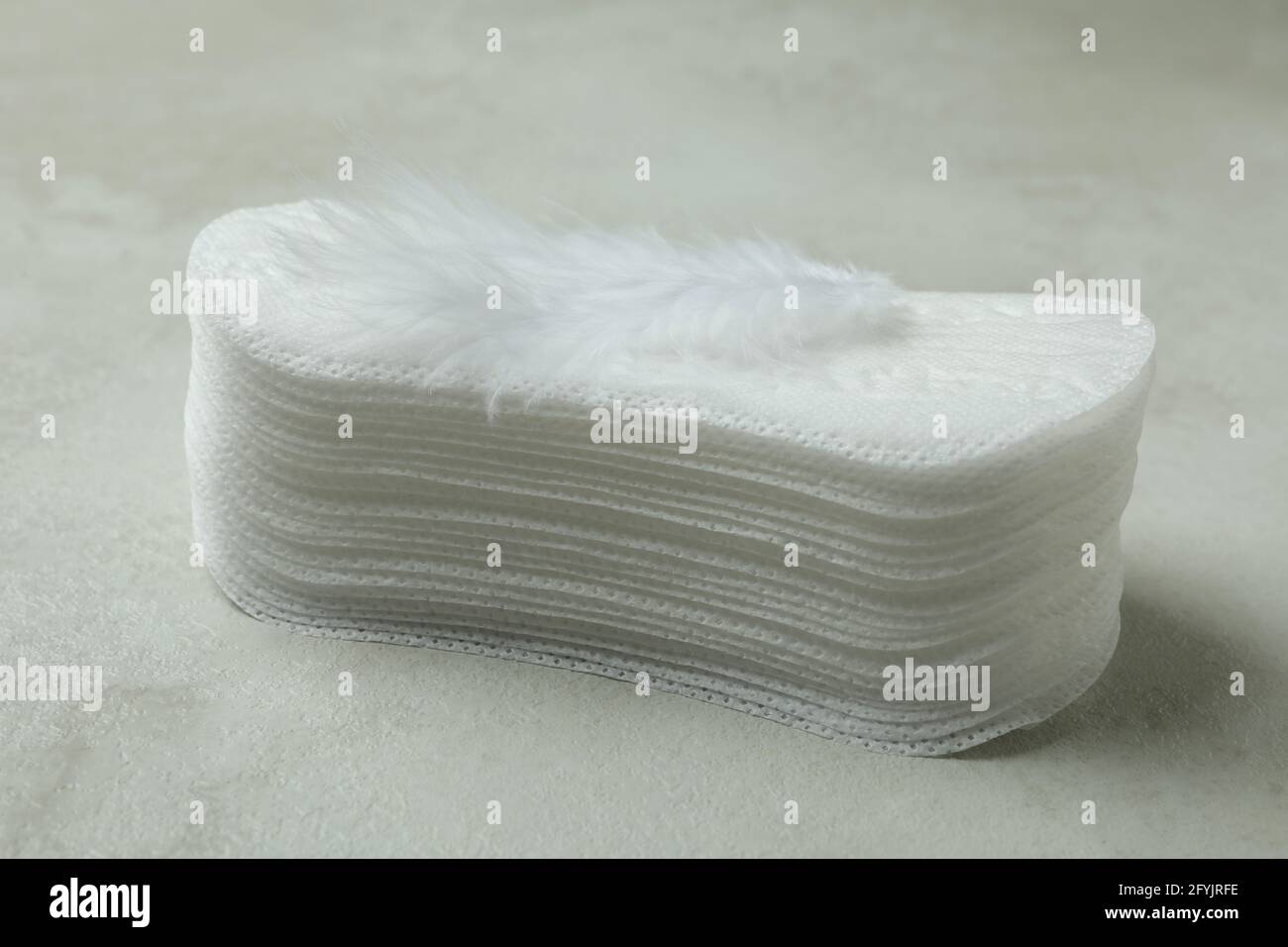 Stack of sanitary pads on white textured background Stock Photo - Alamy