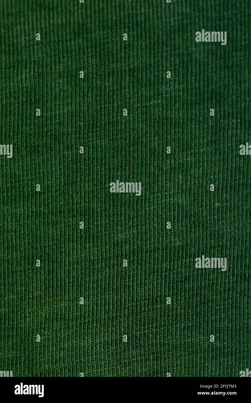 Vertical shot of green fabric matting used for wallpaper or background ...