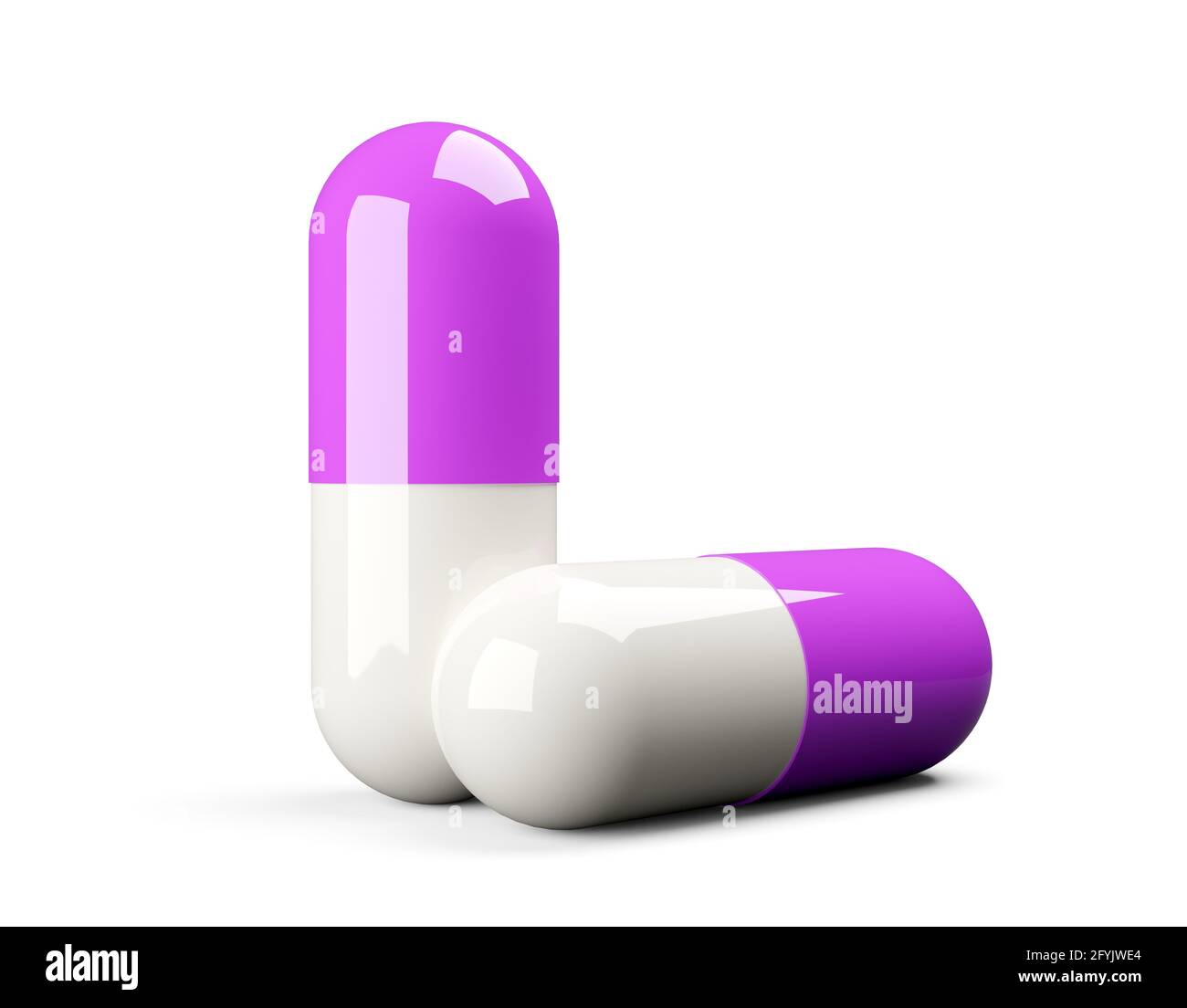 Two pink and white pill capsules over white background, medical ...