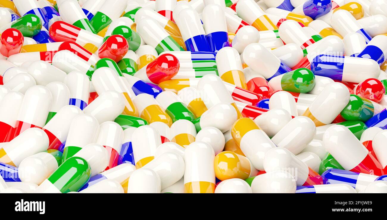 Multi colored pill capsules heap frame filling background, medical ...