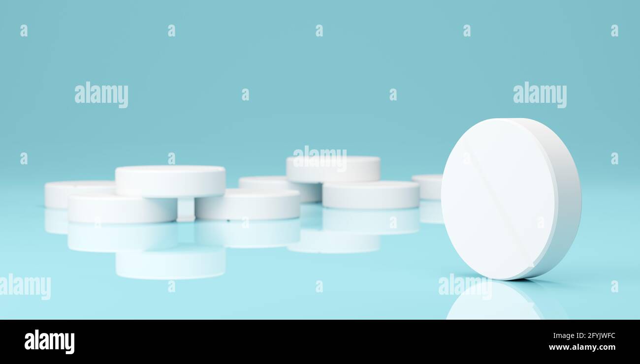 White pills over blue background, medical treatment, pharmaceutical or ...