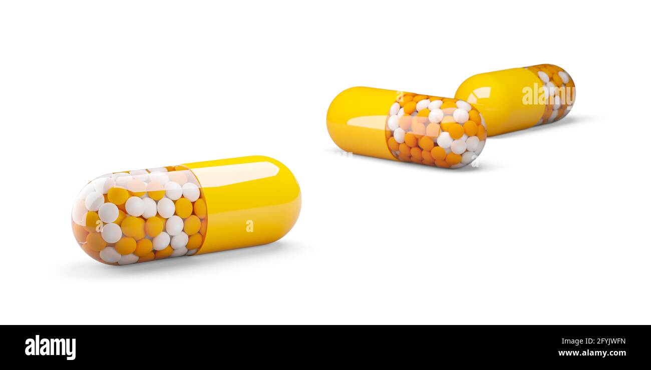 Yellow and white pill capsules over white background, medical treatment ...