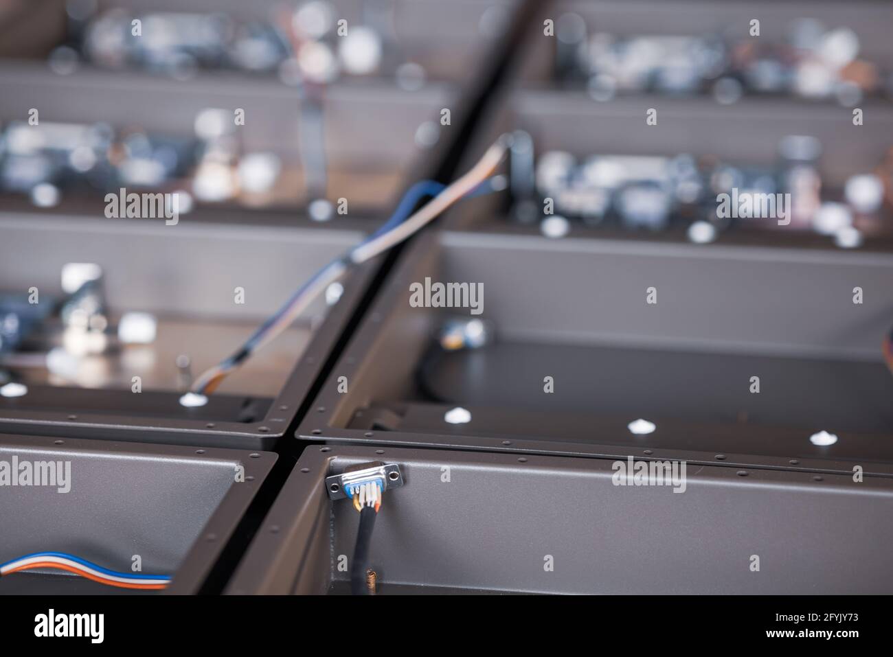 Metal components and microcircuits lie on metal compartments during the ...