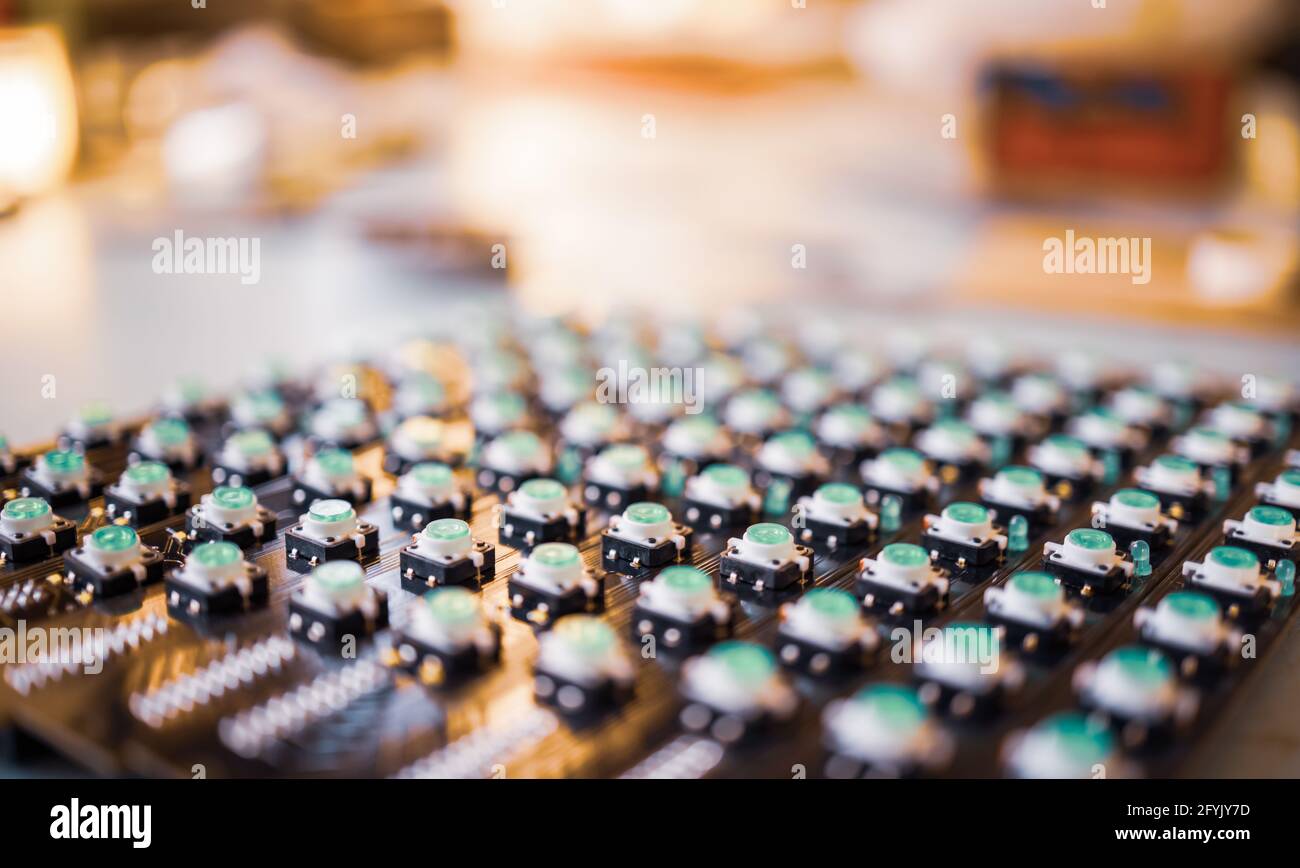 Close-up of a LED panel of green light indicators is in the production ...