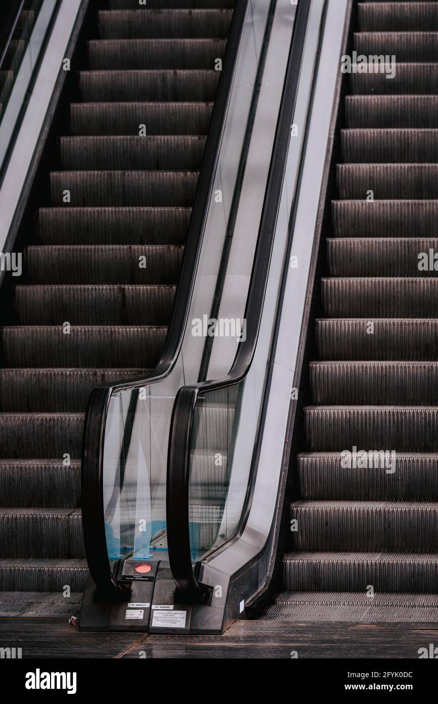 Vertical shot of a modern escalator in a mall Stock Photo - Alamy