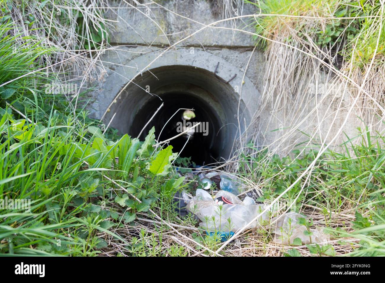Pile of garbage on green grass in nature environmental problems ...