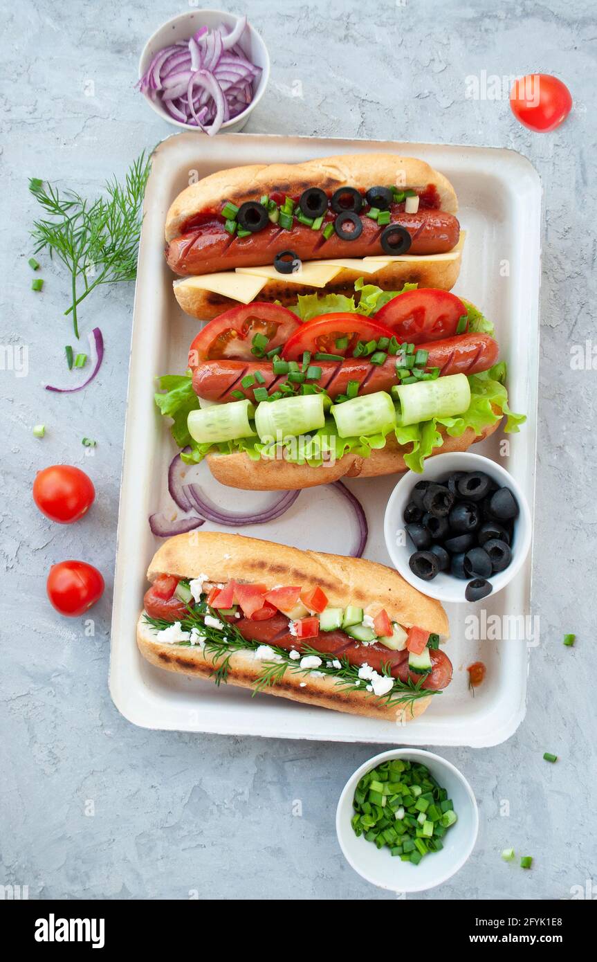Delicious freshly cooked hot dogs fully loaded with assorted toppings ...