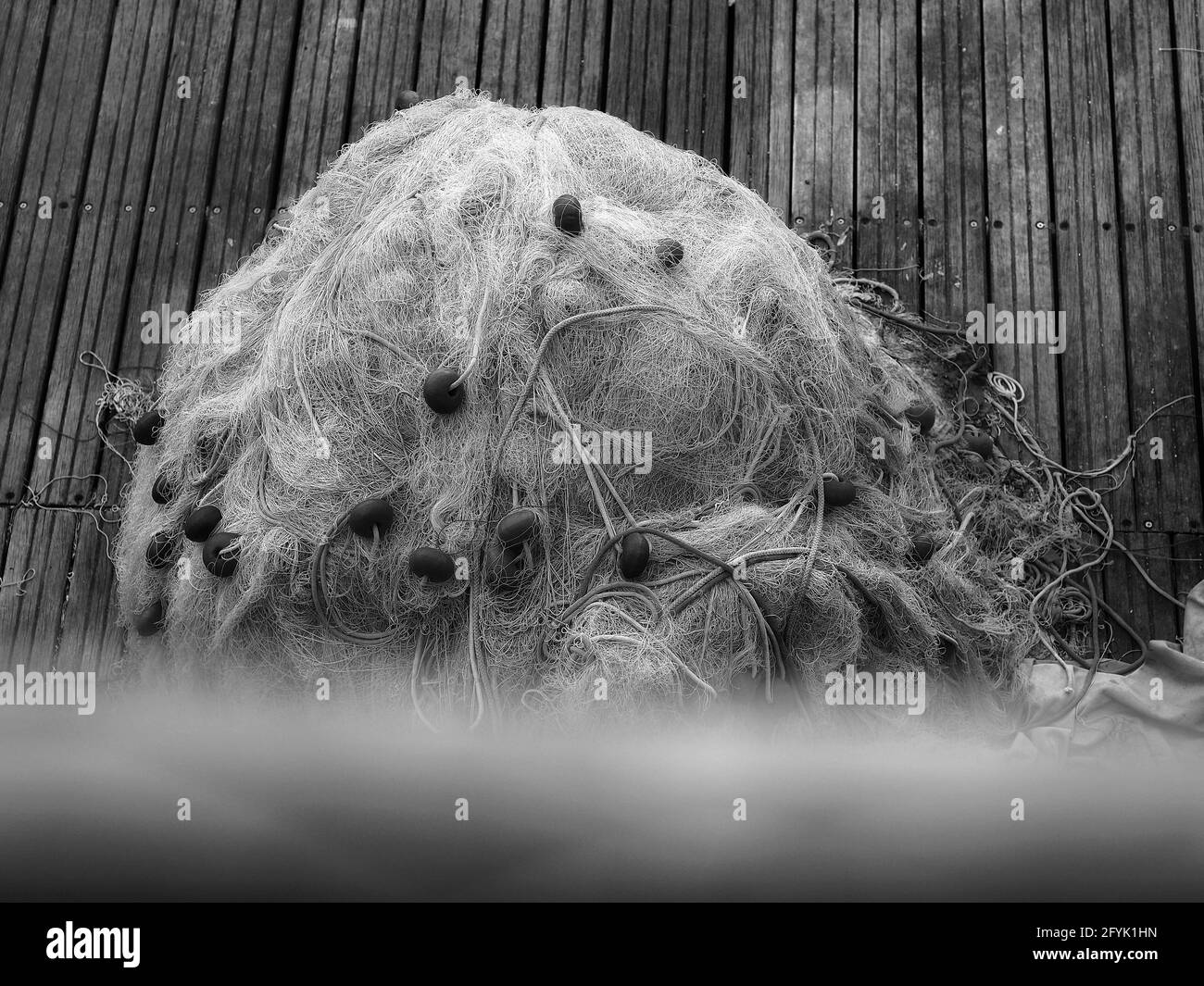 Fish net in harbor Black and White Stock Photos & Images - Alamy