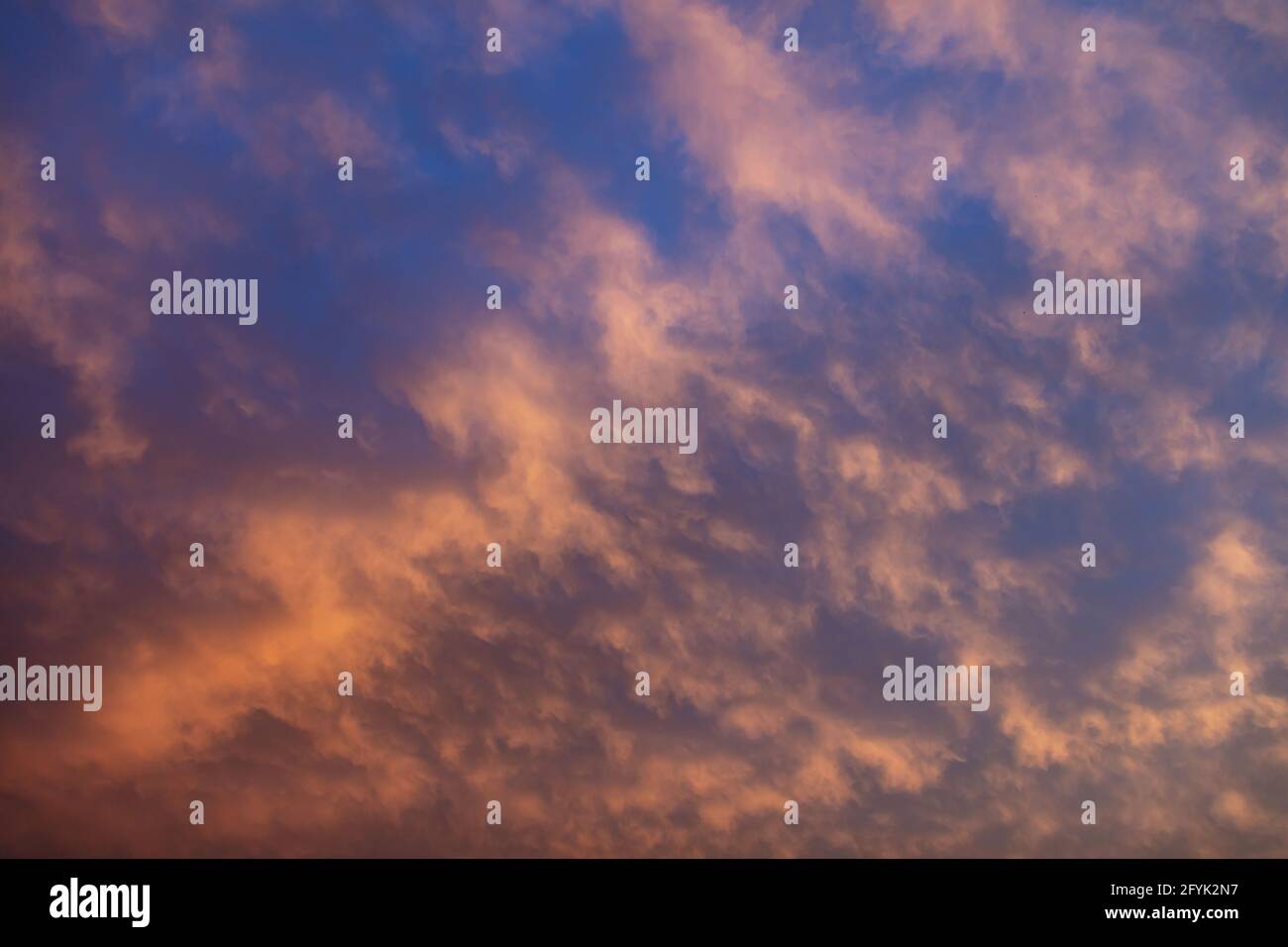 Coloring the sky concept. Sunbeams through heavy clouds paint the ...