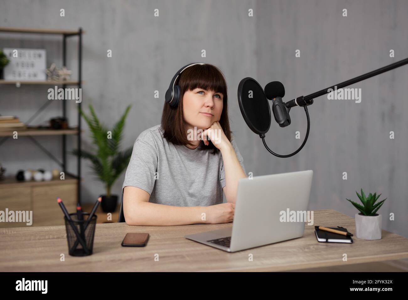 creativity, idea and podcast concept - thoughtful young female audio ...