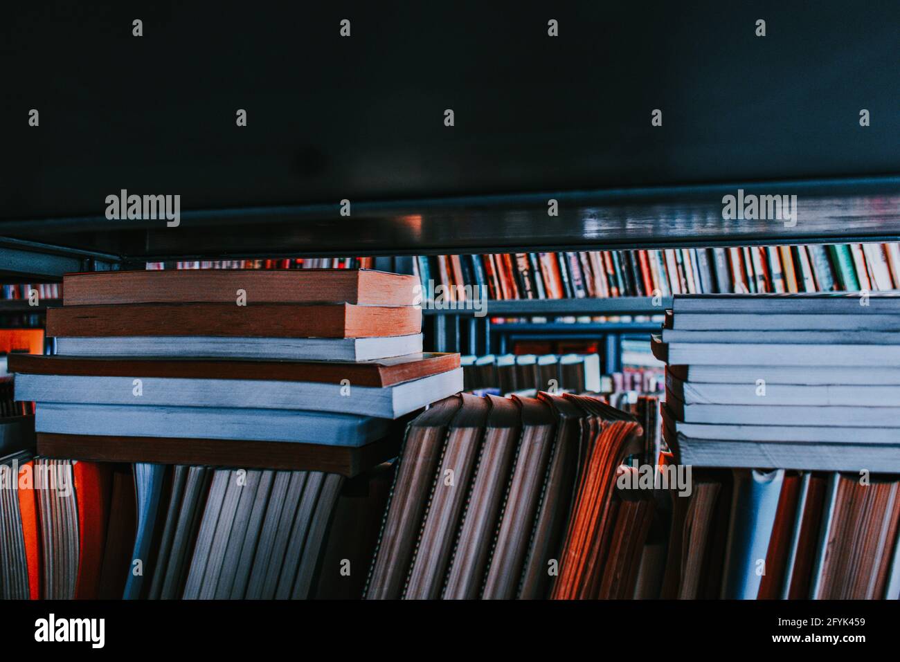 Library with a lot of different books Stock Photo - Alamy