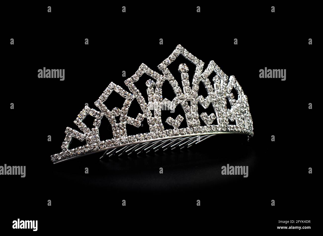 silver tiara isolated on a black background Stock Photo - Alamy