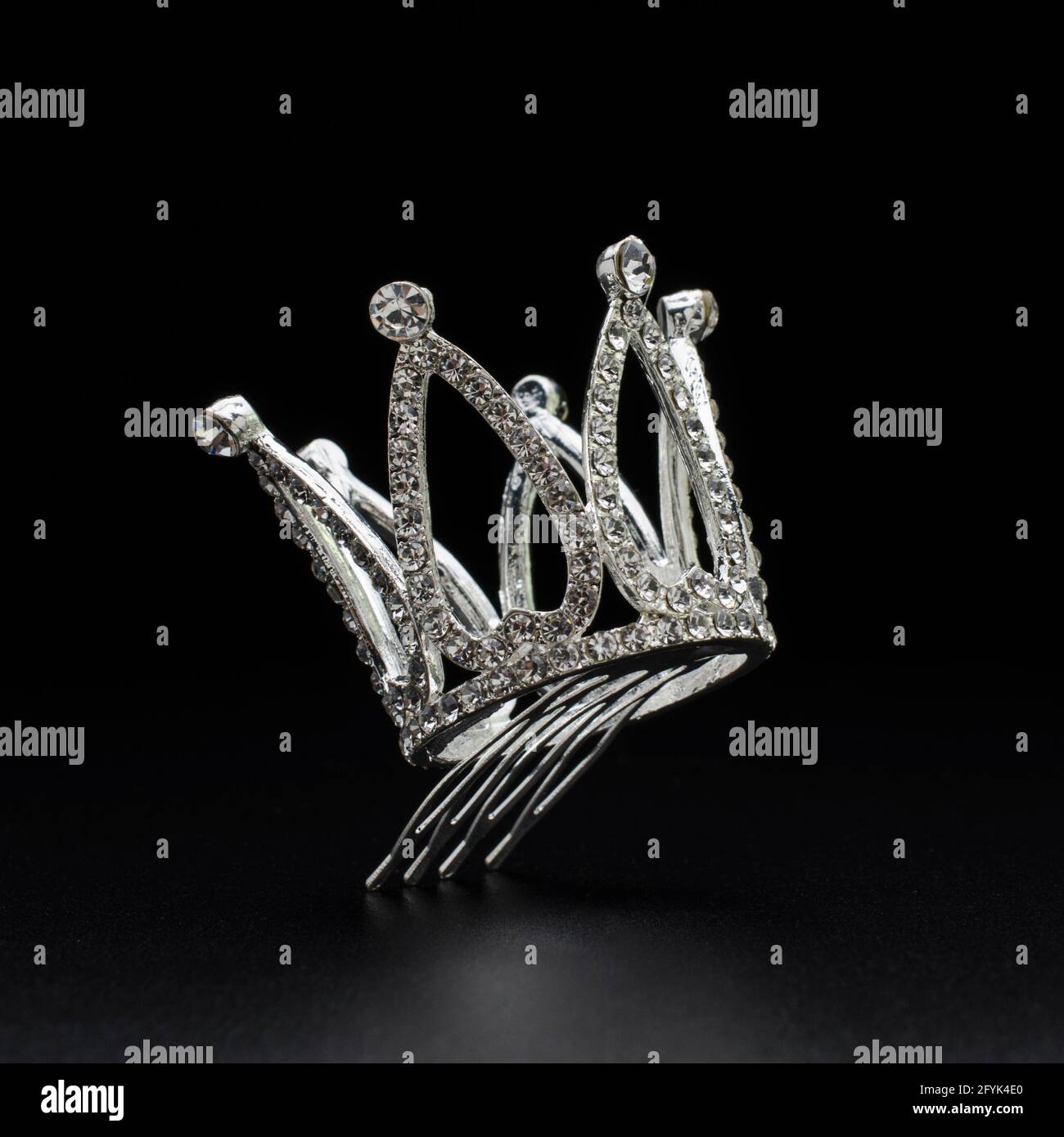 silver crown isolated in black background Stock Photo - Alamy