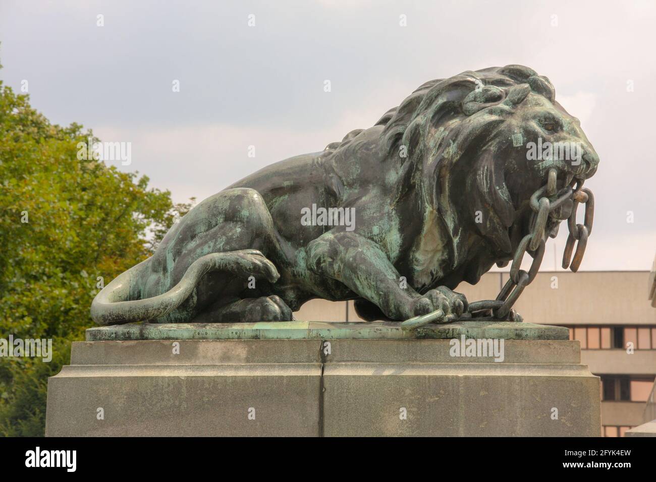 Bronze lion tearing the chains with his mouth, Monument of Freedom in ...