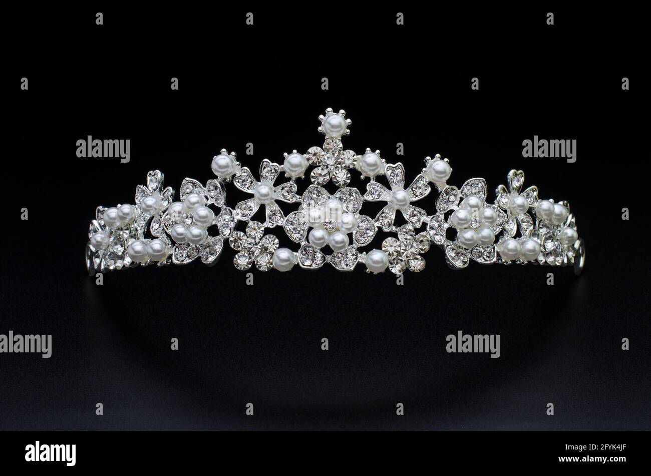 tiara with pearls isolated on a black background Stock Photo - Alamy