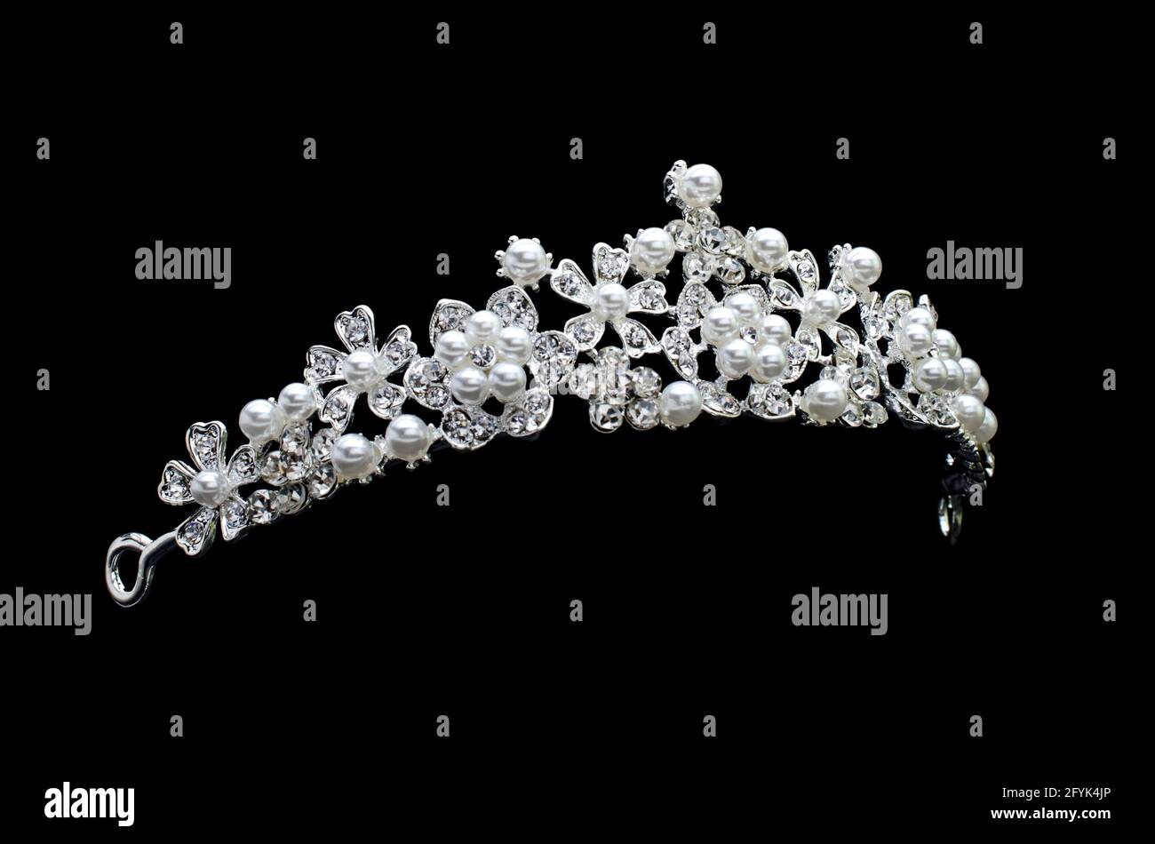 tiara with pearls isolated on a black background Stock Photo - Alamy