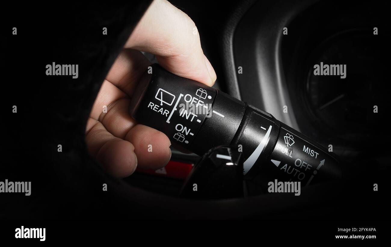 Steering wheel and man hand. Black leather modern car Interior close up ...