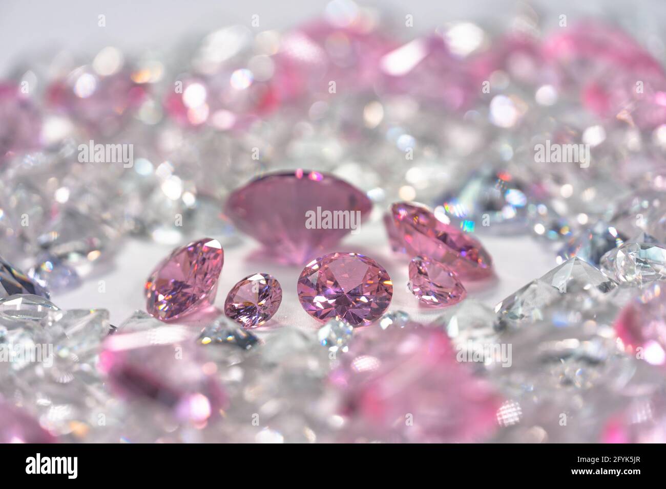 A group of pink diamonds arranged in the middle of white diamonds in a ...