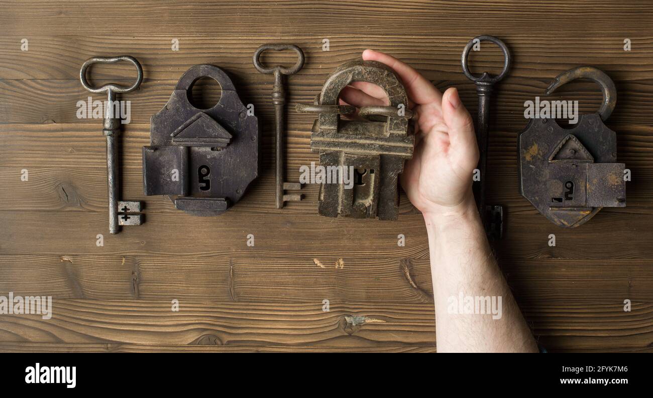 Vintage padlock on hand Stock Photo - Alamy
