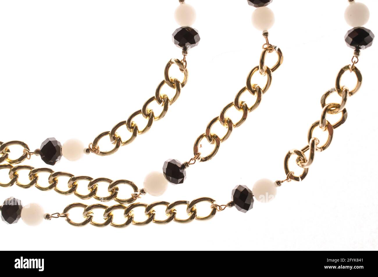 Chains with stones on a white background Stock Photo - Alamy