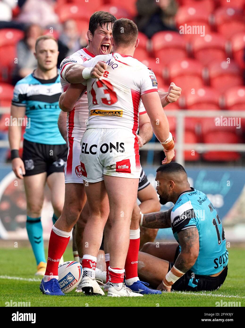 St Helens Louie McCarthy-Scarsbrook (left) celebrates the try scored by ...