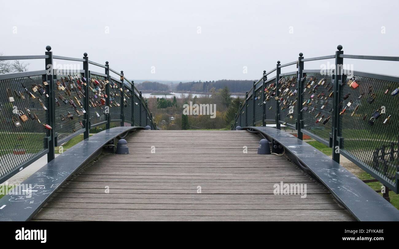 Lots of padlocks on the railing of the footbridge. Padlocks symbolizing ...