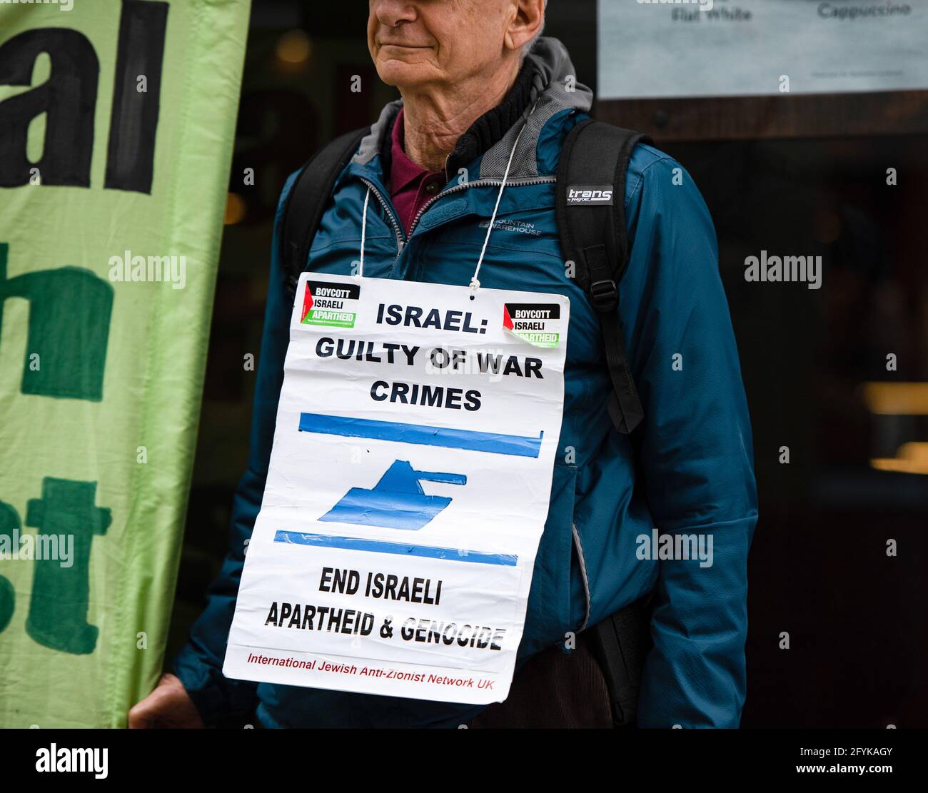 An activist wears a sign during the Shut Elbit Down demonstration at ...
