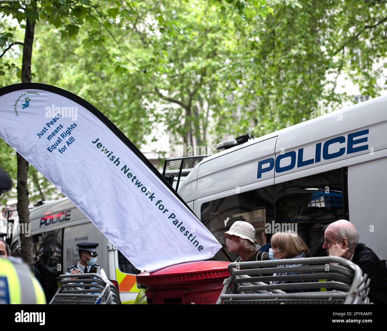 Activists hold a banner saying Jewish Network for Palestine during the ...