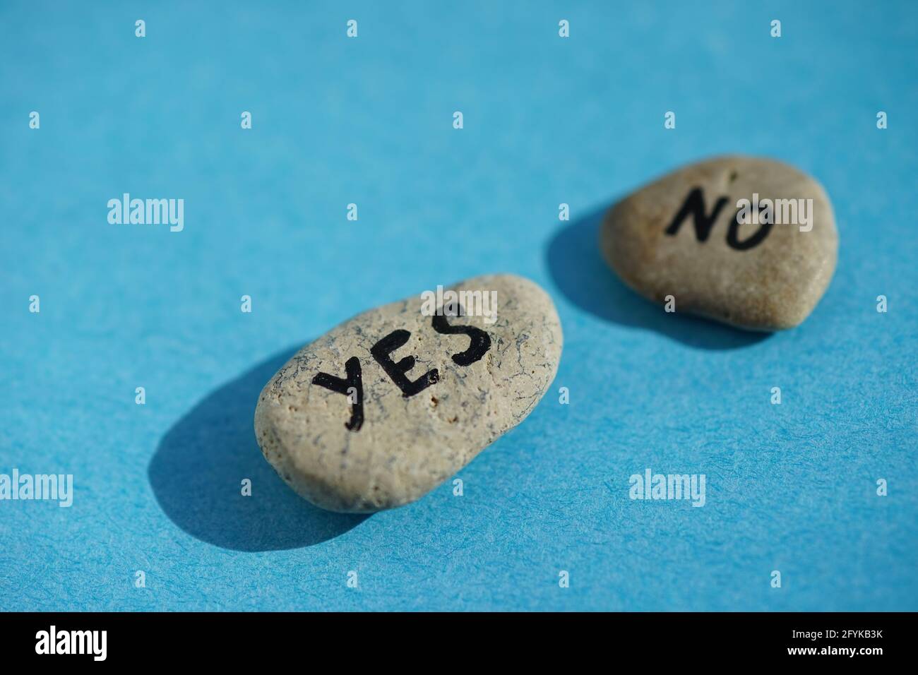 Two pebbles yes no hi-res stock photography and images - Alamy