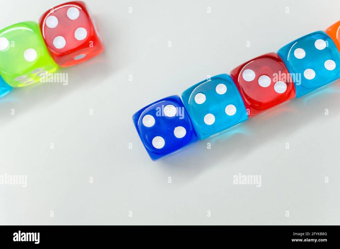 Top view of colorful transparent dice on white background Stock Photo ...