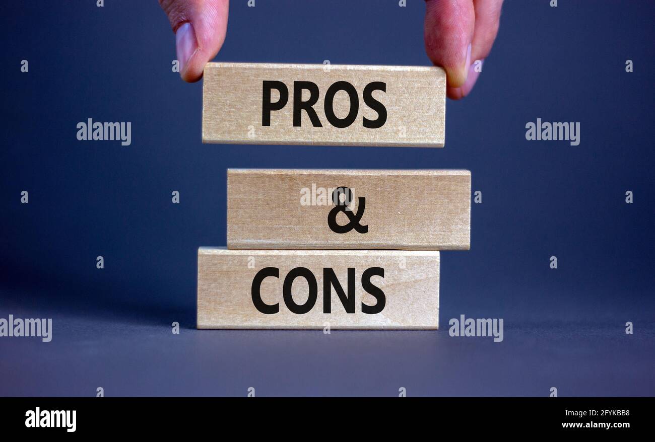 Pros and cons symbol. Wooden blocks with words 'Pros and cons ...