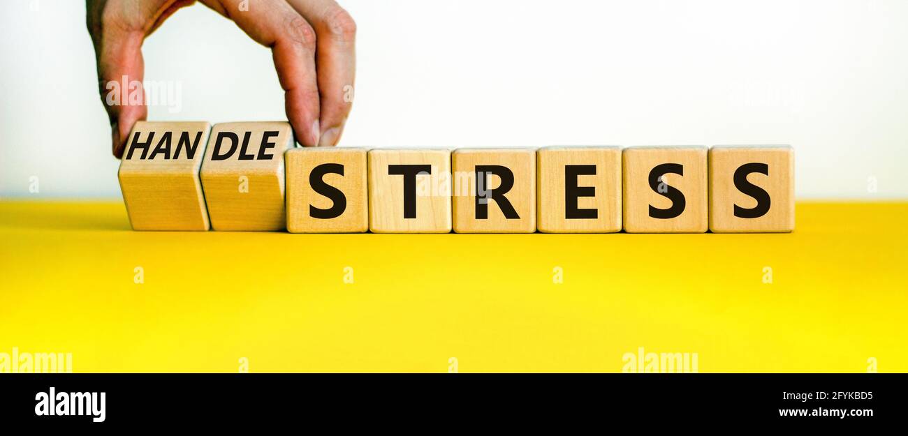 Handle stress symbol. Businessman turns cubes and changes words 'stress ...
