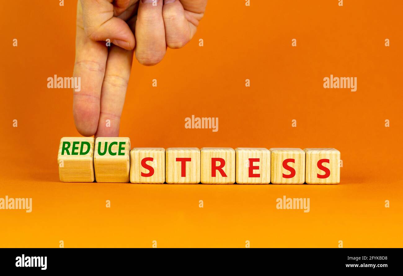 Reduce stress symbol. Businessman turns cubes and changes words 'stress ...