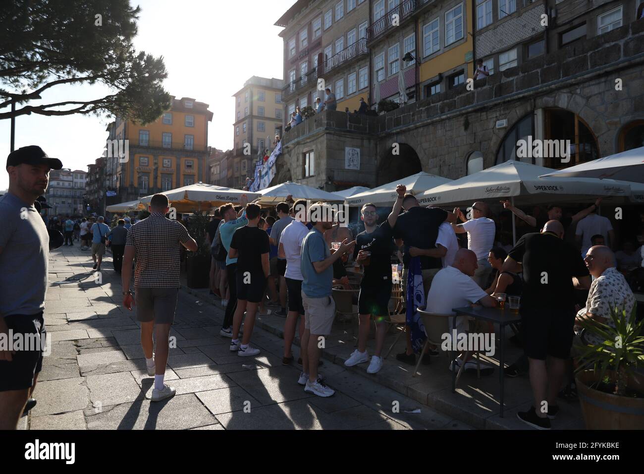English fans of Chelsea and Manchester City drink beer in the host city ...
