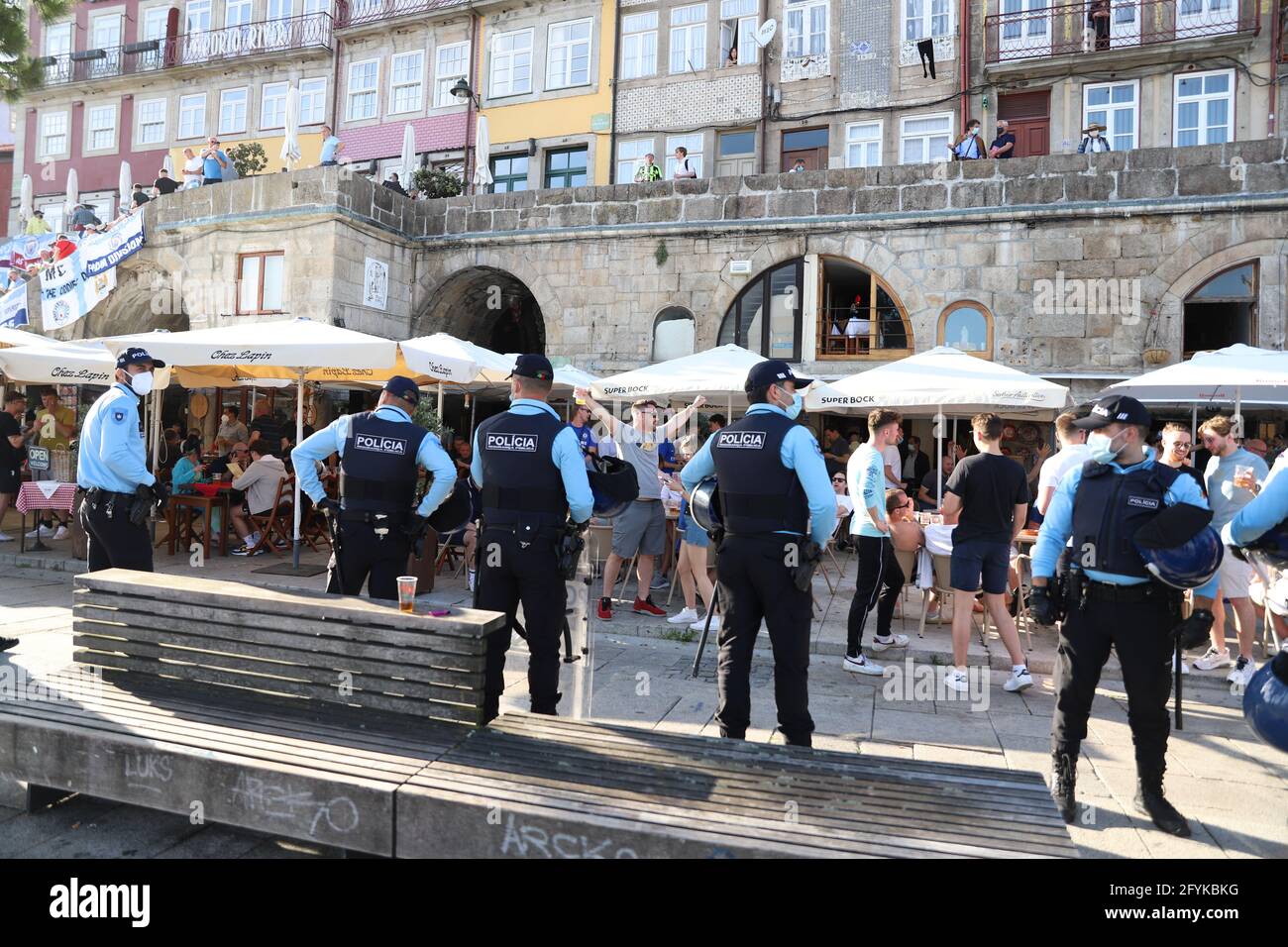 English fans of Chelsea and Manchester City drink beer in the host city ...