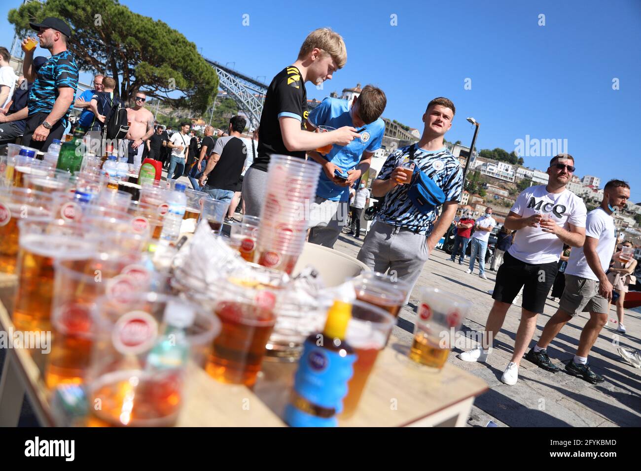 English fans of Chelsea and Manchester City drink beer in the host city ...