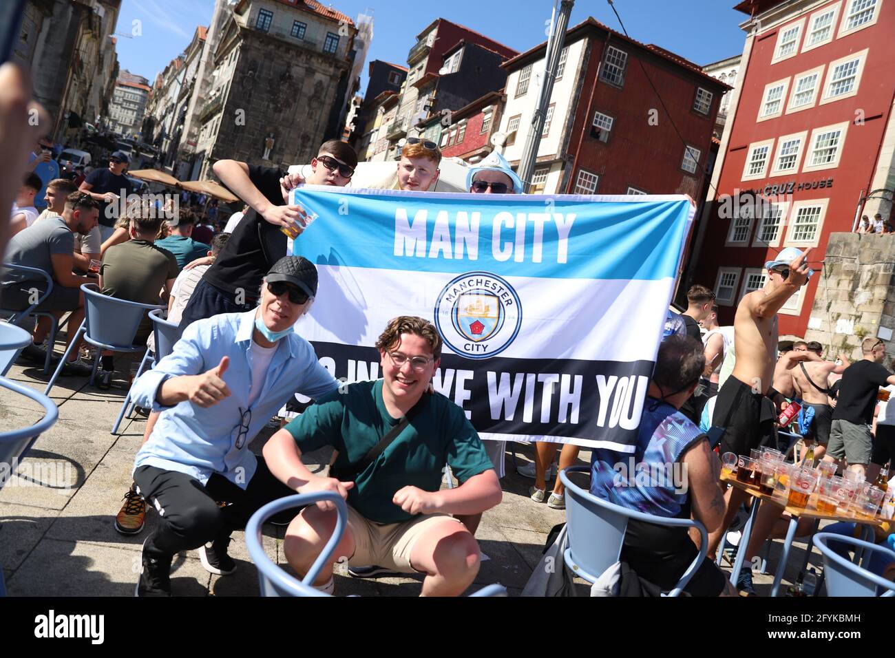 English fans of Chelsea and Manchester City drink beer in the host city ...