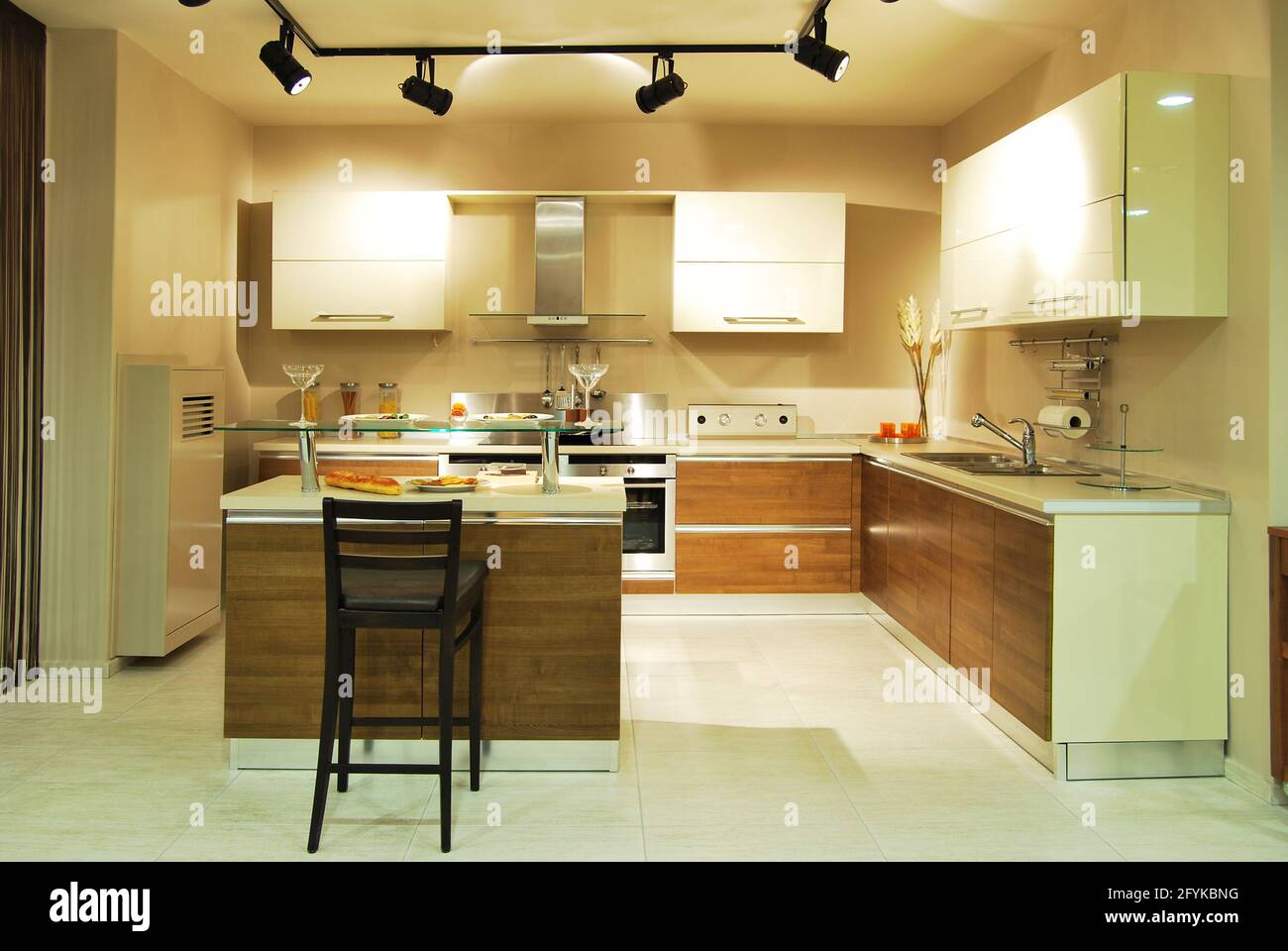 Interior of luxurious modern kitchen equipment, white and walnut ...