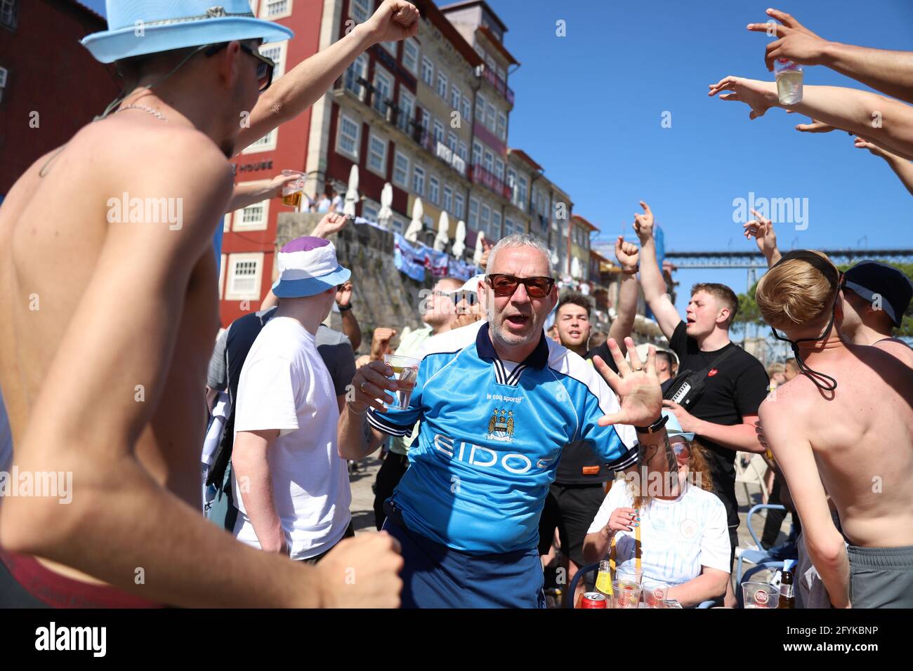 English fans of Chelsea and Manchester City drink beer in the host city ...
